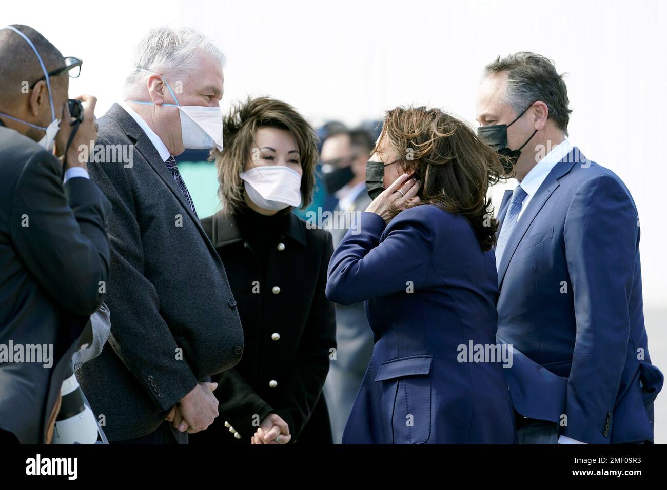 Vice President Kamala Harris and her husband, Doug Emhoff, are greeted ...