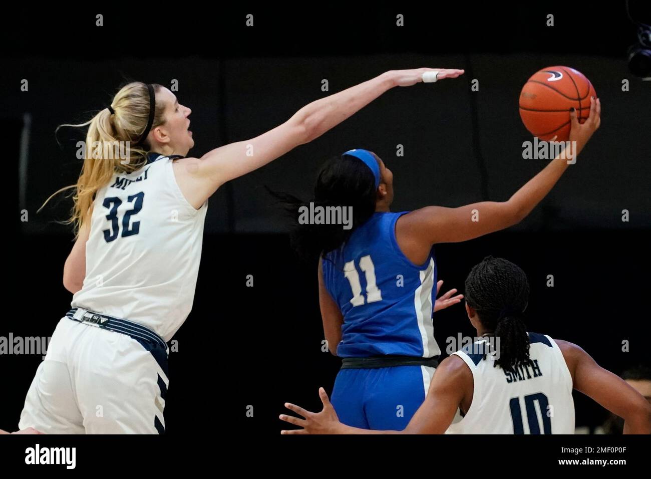 Rice center Nancy Mulkey (32) tries to block a shot by Middle Tennessee ...