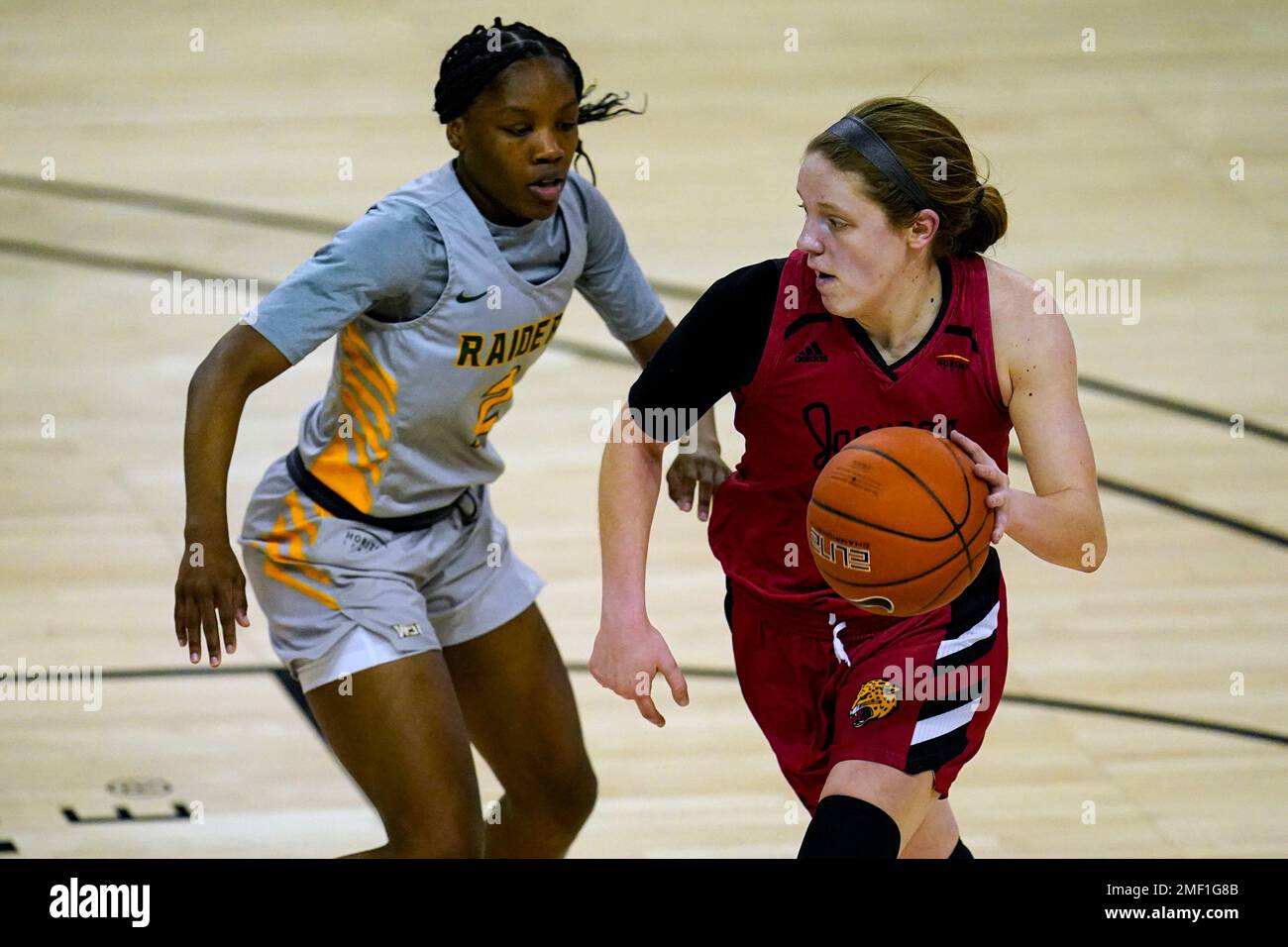 IUPUI guard Rachel McLimore (14) drives on Wright State guard Destyne ...