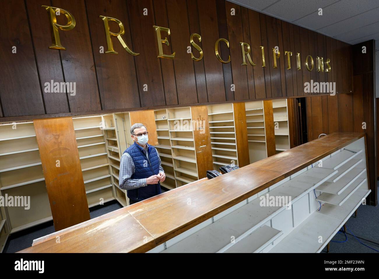 Retired pharmacist, Russell Alan Garner, stands behind the counter in ...