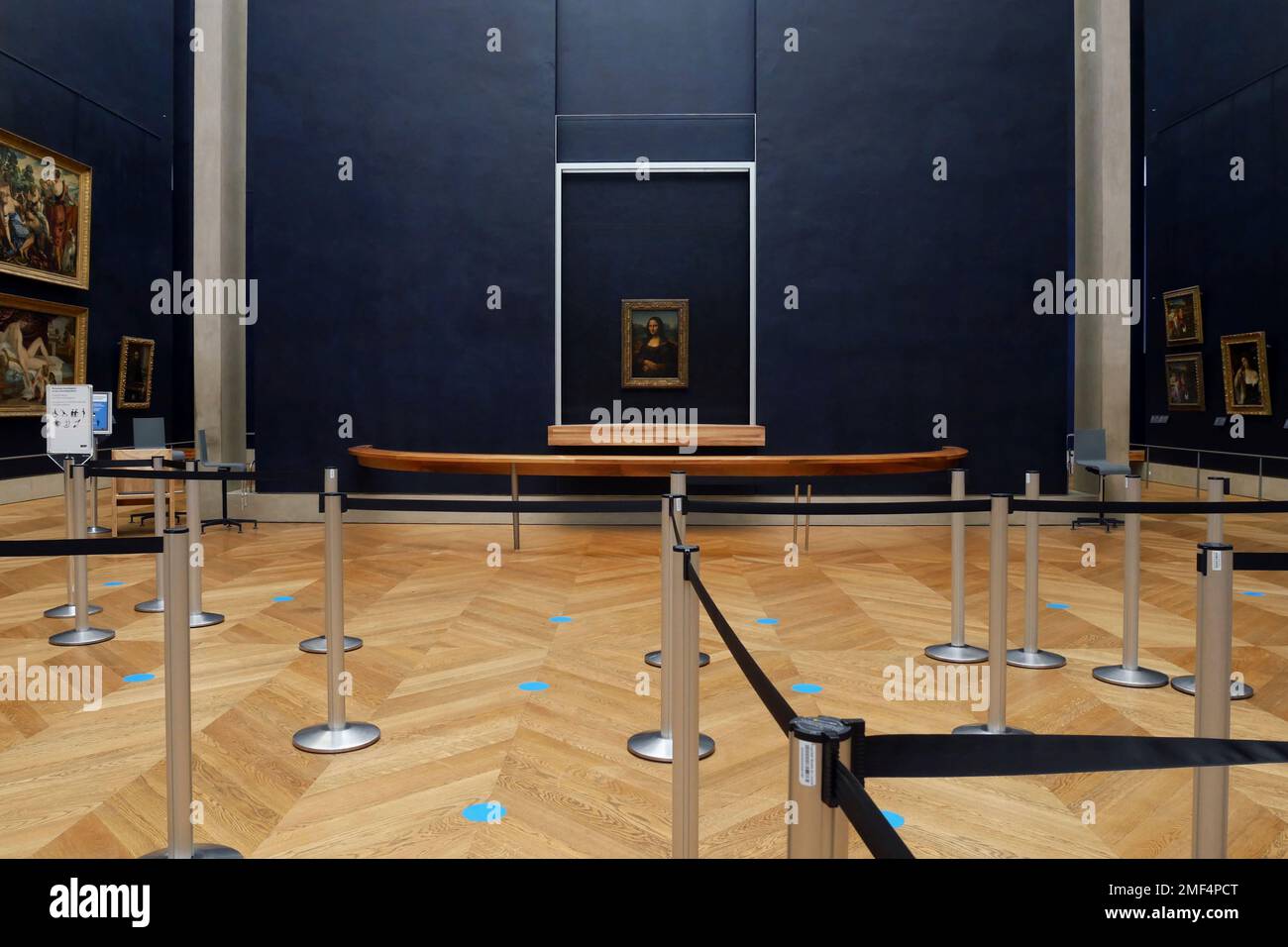 Leonardo da Vinci's Mona Lisa hangs on the wall in a deserted Louvre ...