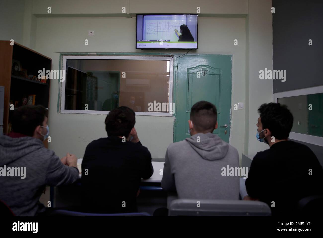 Inmates watch mathematics on "Prospathodas TV," or "Trying TV," the ...