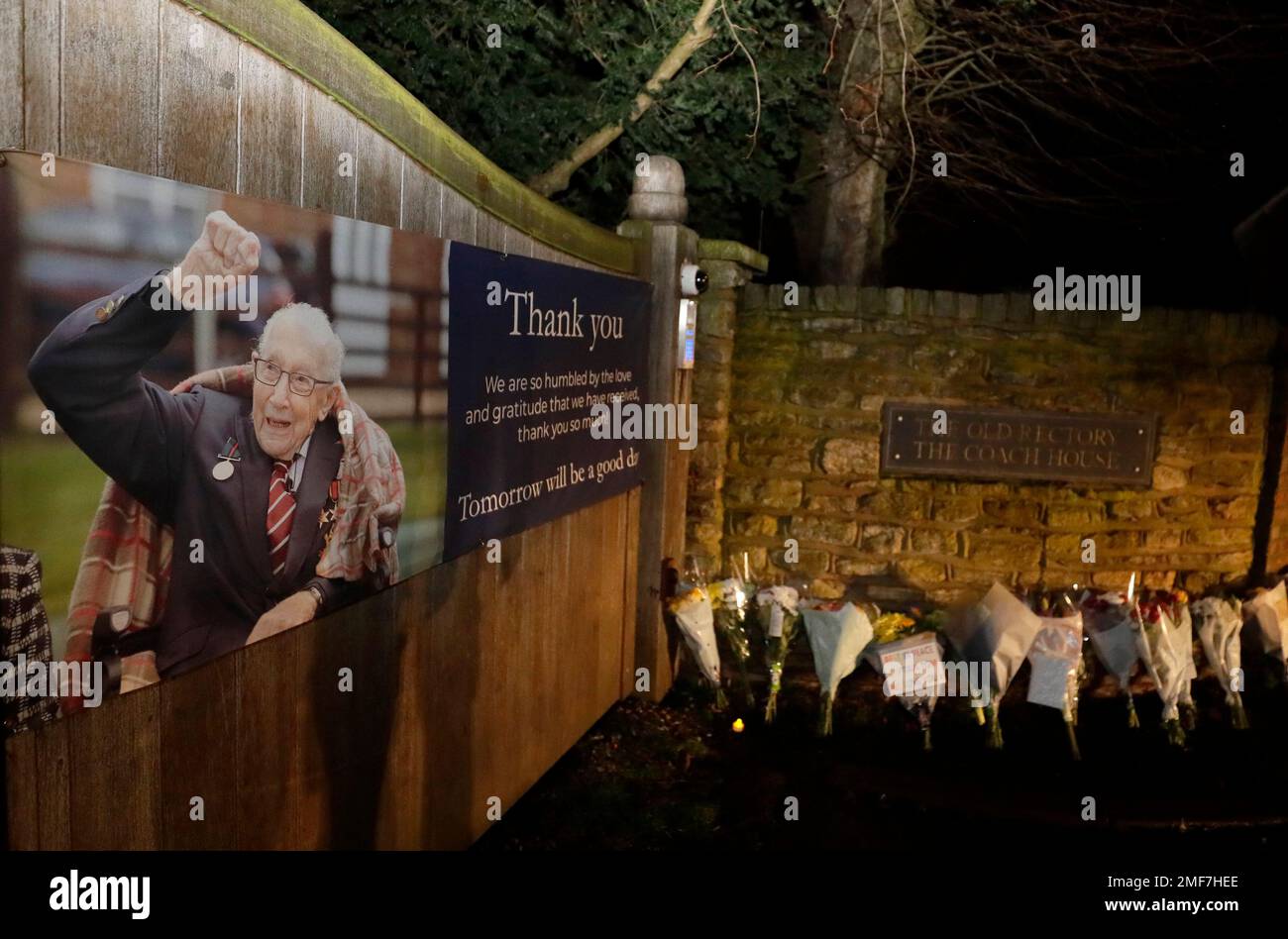 Flowers are placed near the home of Captain Tom Moore in Marston ...