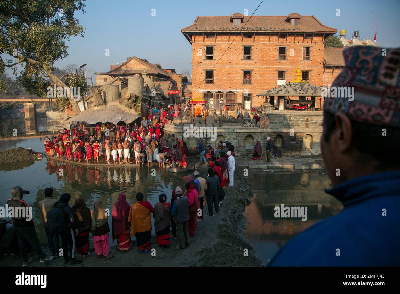 Nepalese Hindu devotees offer prayers along the banks of the Hanumante ...