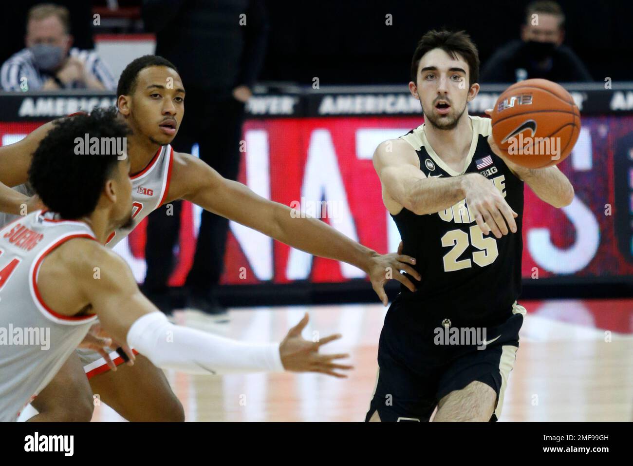 Purdue guard Ethan Morton, right, passes against Ohio State forward ...
