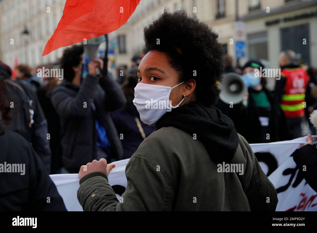 A student holds a banner during a demonstration Wednesday, Jan. 20 ...