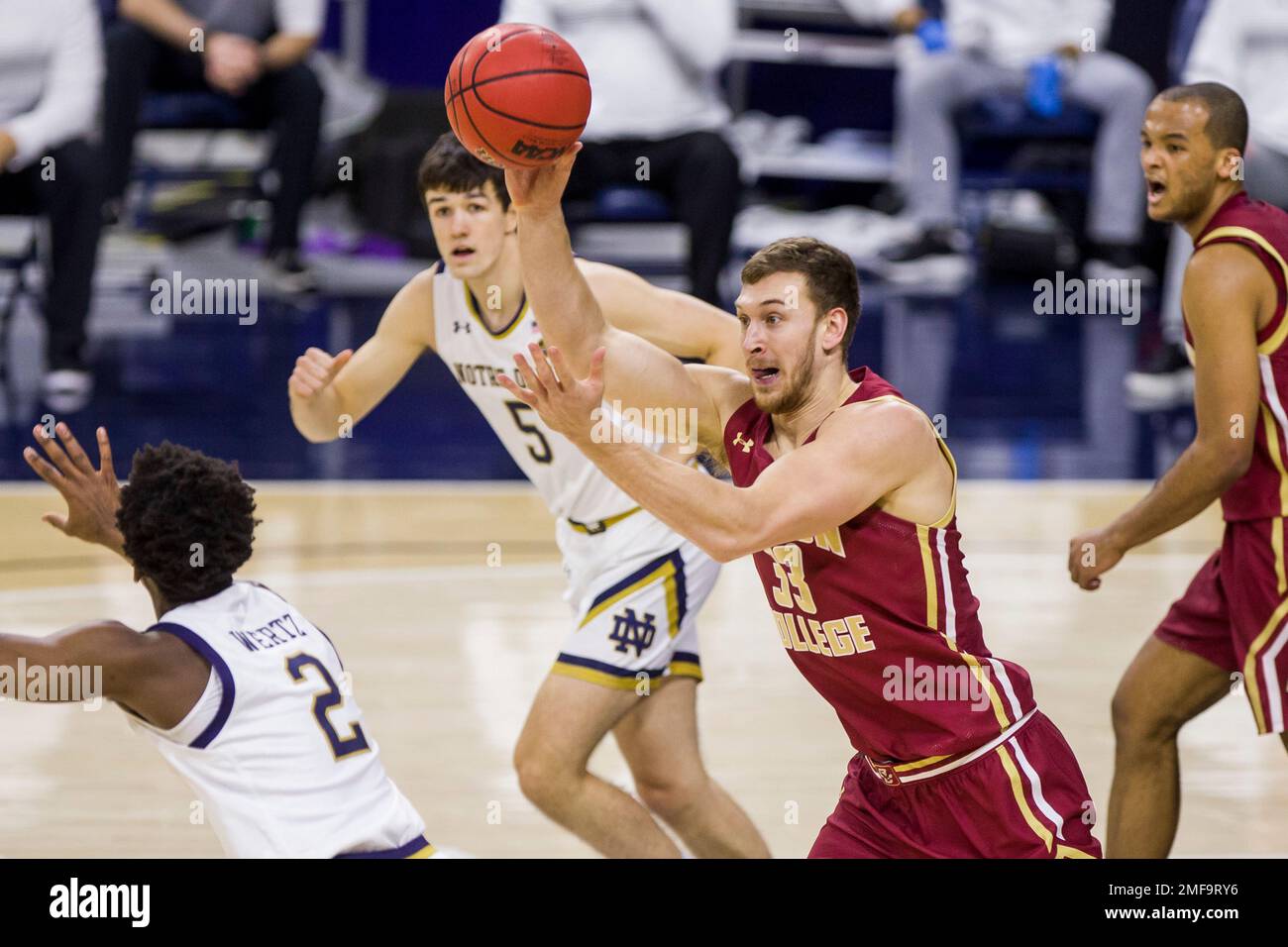 Boston College's James Karnik (33) passes the ball over Notre Dame's ...