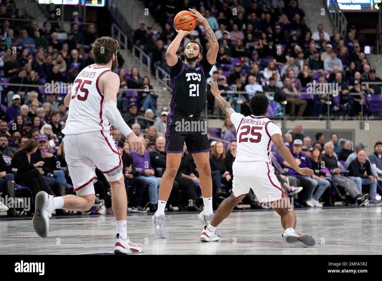 TCU forward JaKobe Coles (21) attempts a three-point shot in the second ...