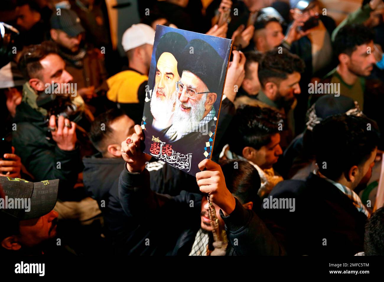Members of the Popular Mobilization Forces (PMF) and their supporters ...