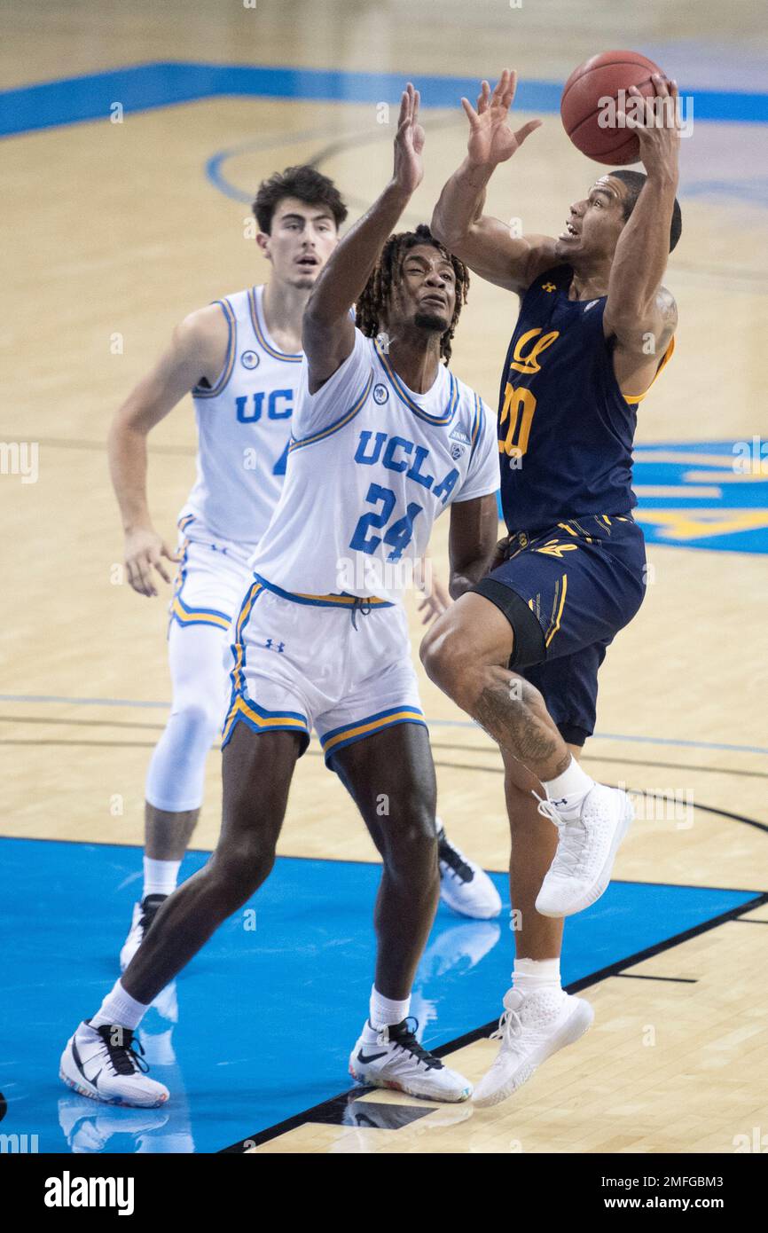 California guard Matt Bradley, right, goes up for a basket over UCLA ...