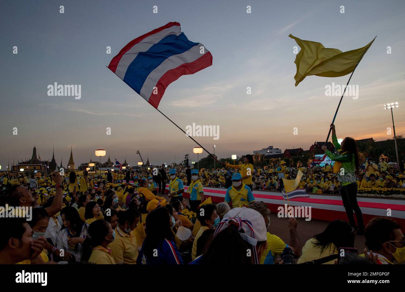 Suppporters of Thai monarch wave national and royal flags ahead of the ...
