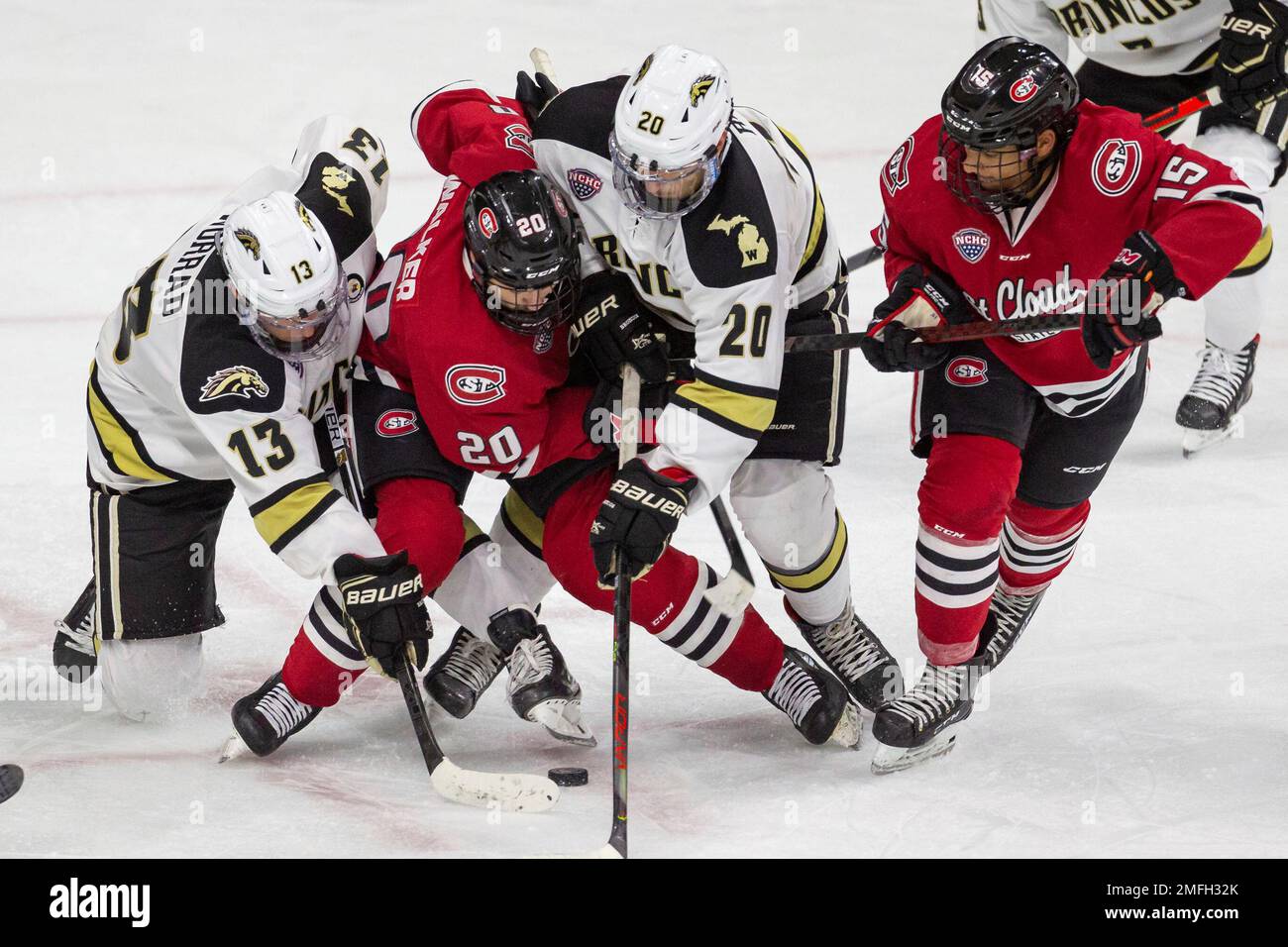 Western Michigan forward Drew Worrad (13), St. Cloud State forward ...