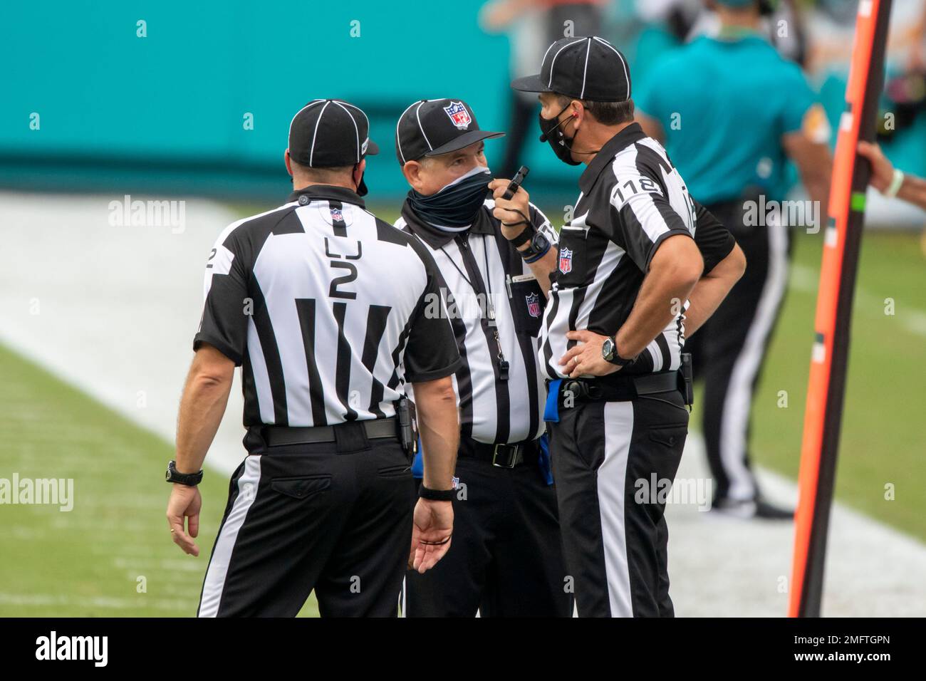 From left, NFL line judge Bart Longson, back judge Greg Wilson and ...