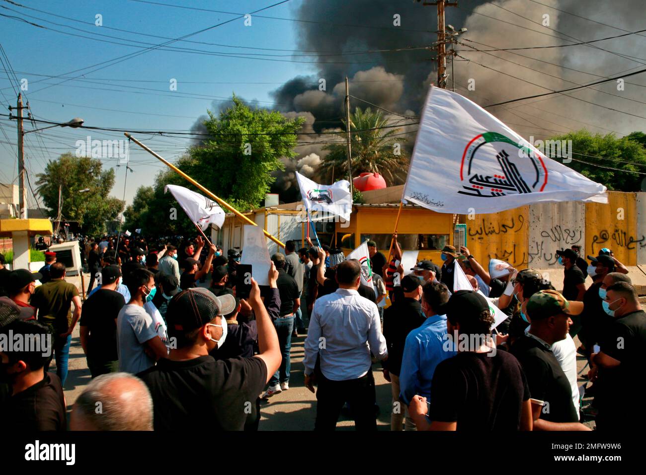 The headquarters of Kurdish Democratic Party burn during a protest by ...