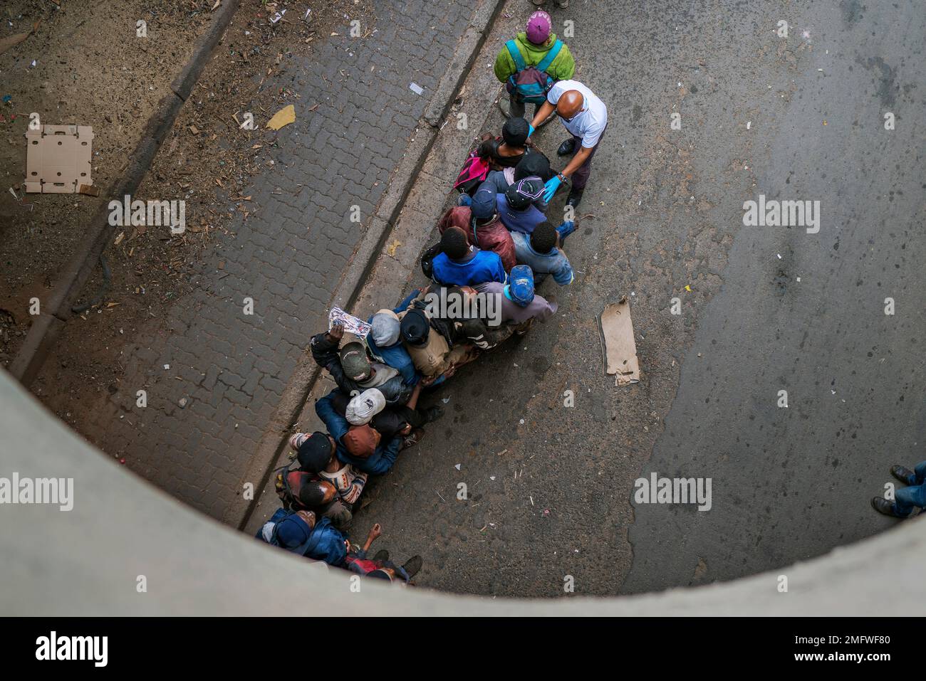 FILE — In this Monday, April 13, 2020 file photo, homeless people queue ...