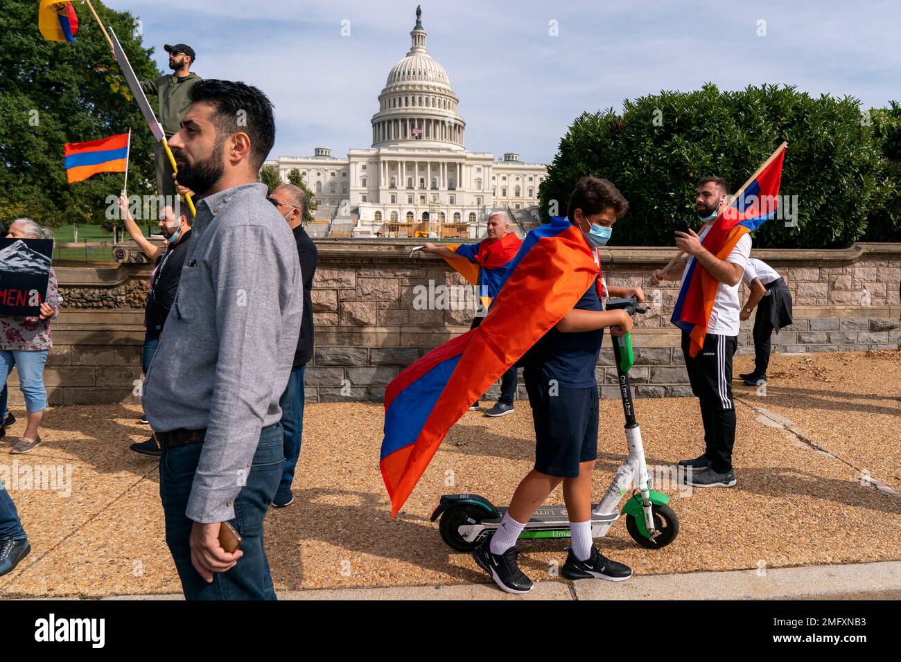 With the U.S. Capitol in the background, Levon Alyanakian, 14, of Los ...