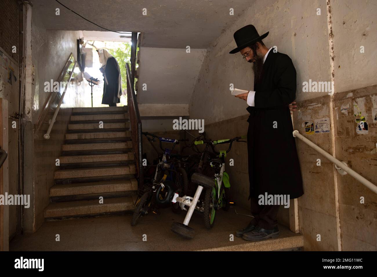 Ultra-Orthodox Jews keep social distancing and wear face masks during a ...