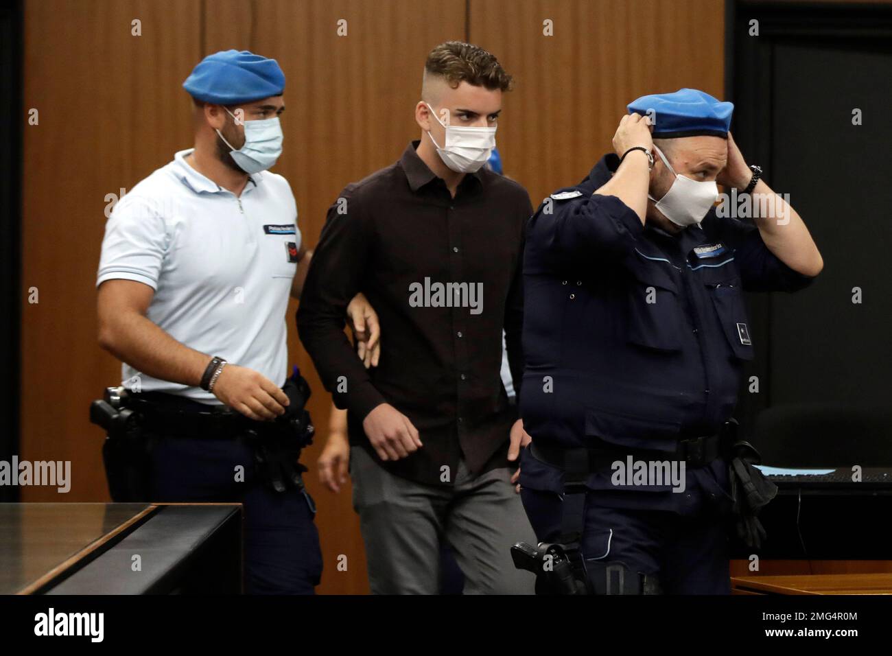 American tourist Gabriel Natale-Hjorth, center, is escorted inside the ...
