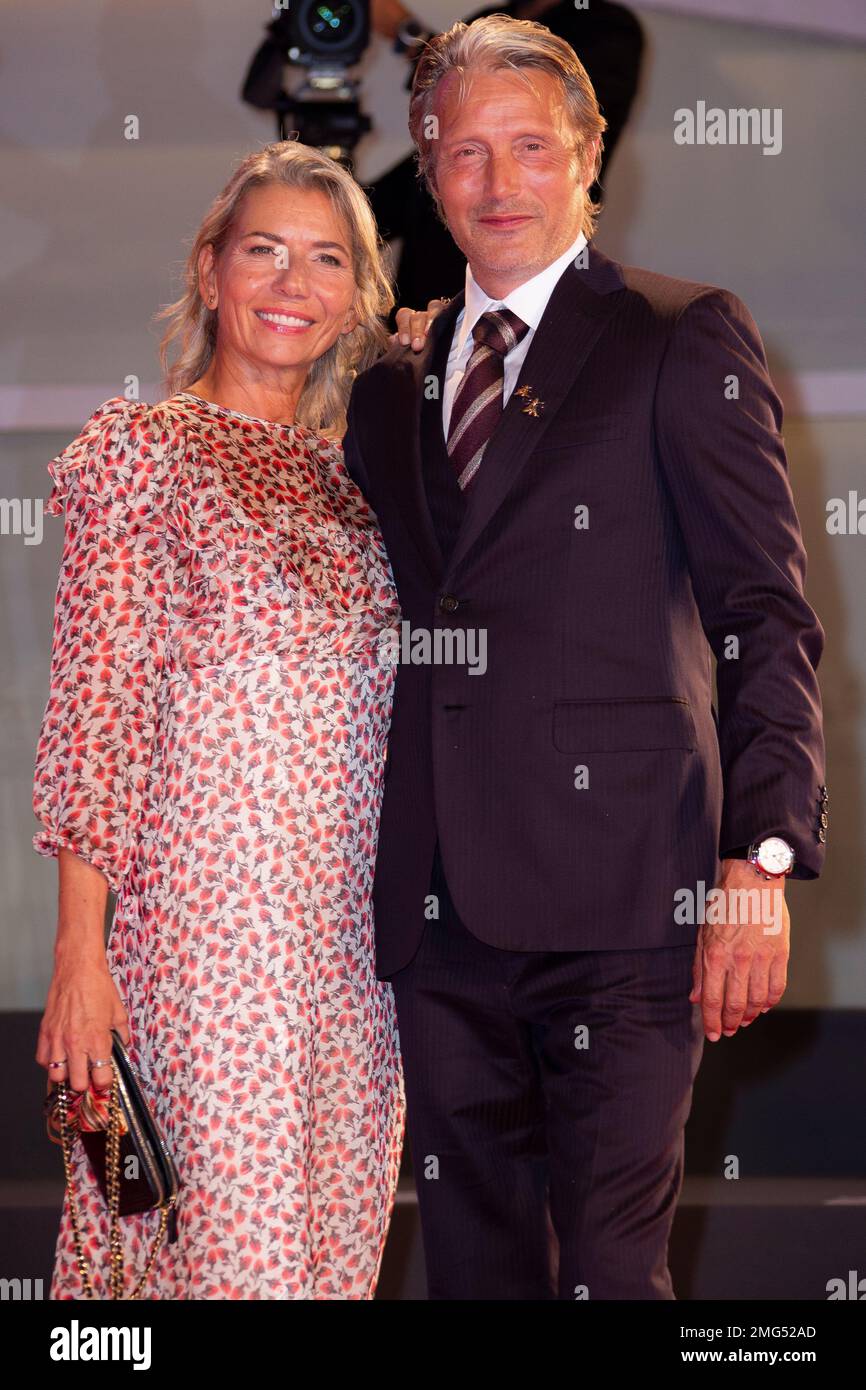 Actor Mads Mikkelsen, right, and Hanne Jacobsen pose for photographers ...