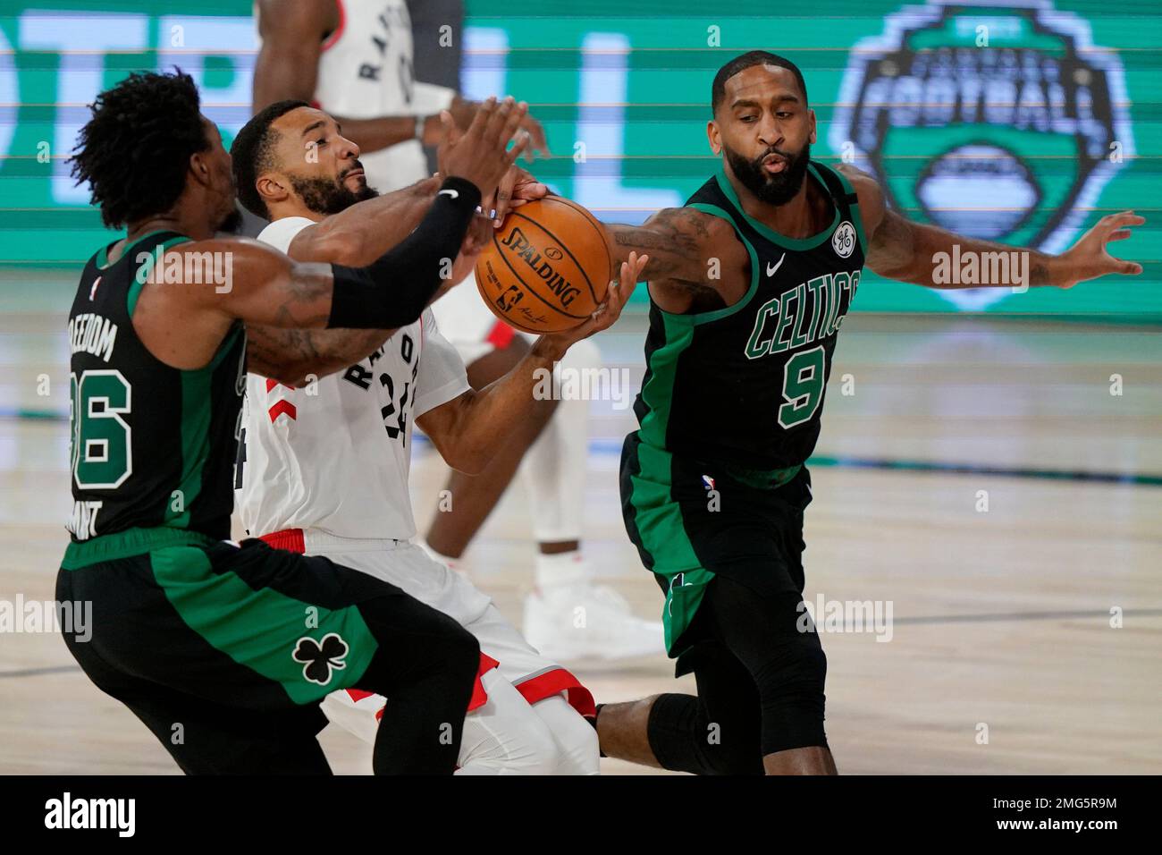 Boston Celtics' Brad Wanamaker (9) and Marcus Smart (36) reach in to ...