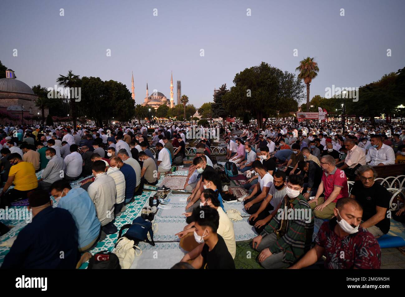 Muslims, wearing protective masks as a precaution against the ...