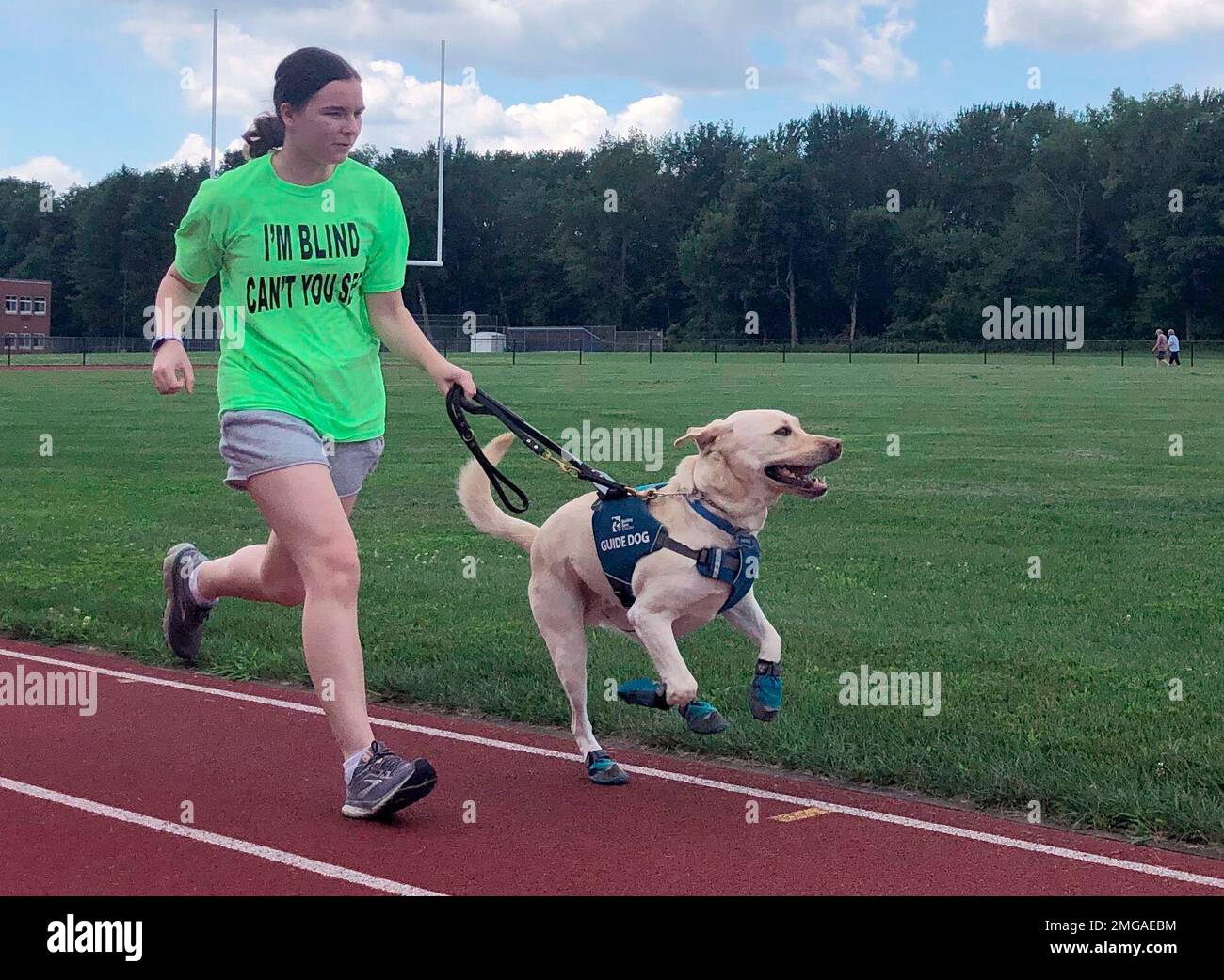 Megan Hale, who is visually impaired, runs on the high school track ...