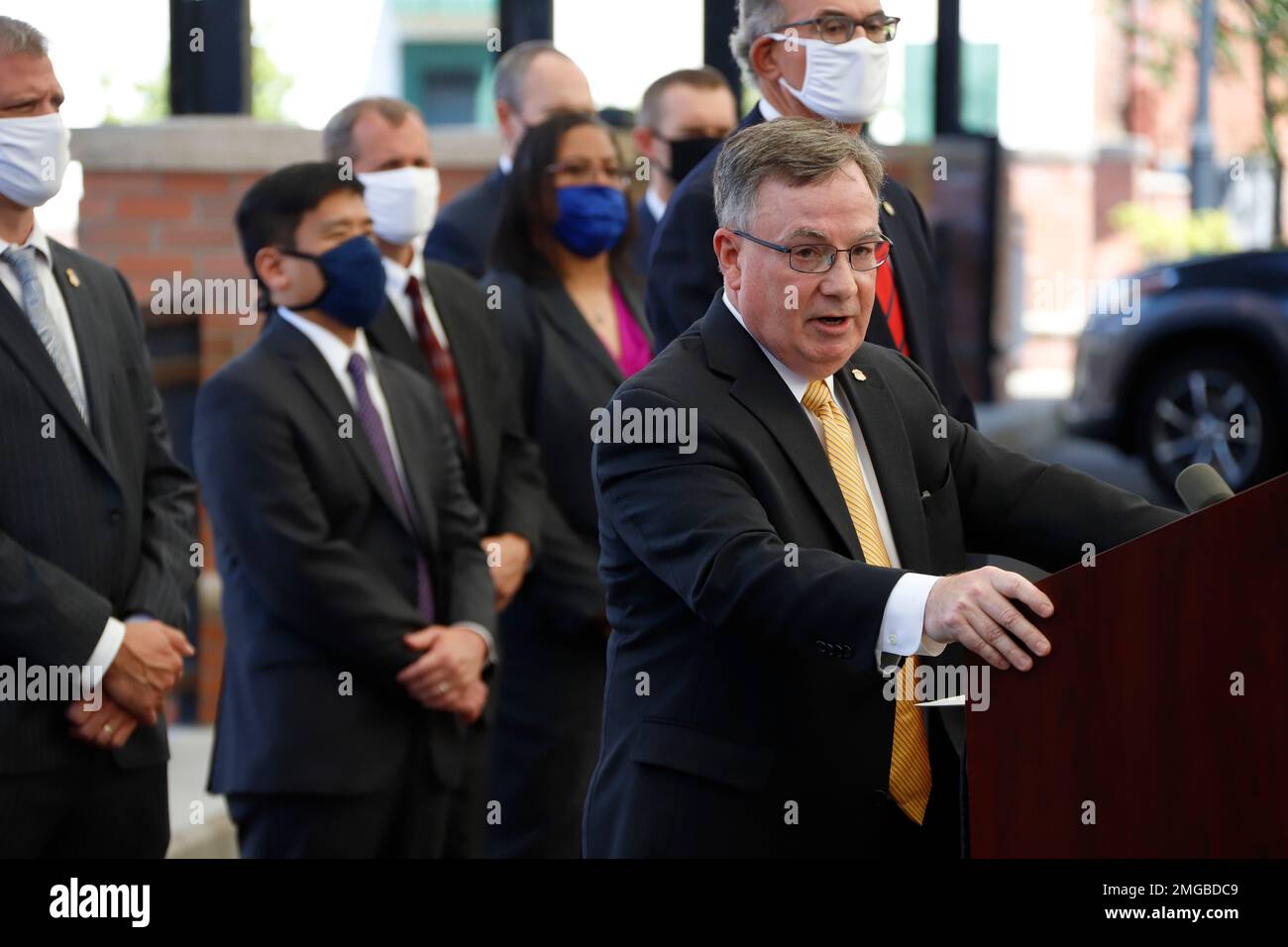 U.S. Attorney Bill Powell, right front, announces at a news conference ...