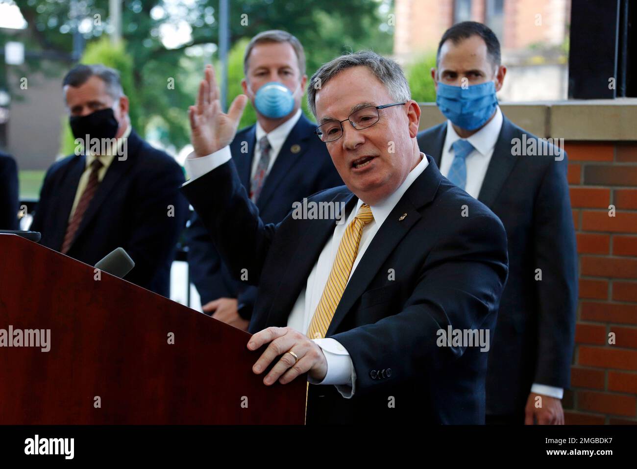 U.S. Attorney Bill Powell, center, announces at a news conference ...