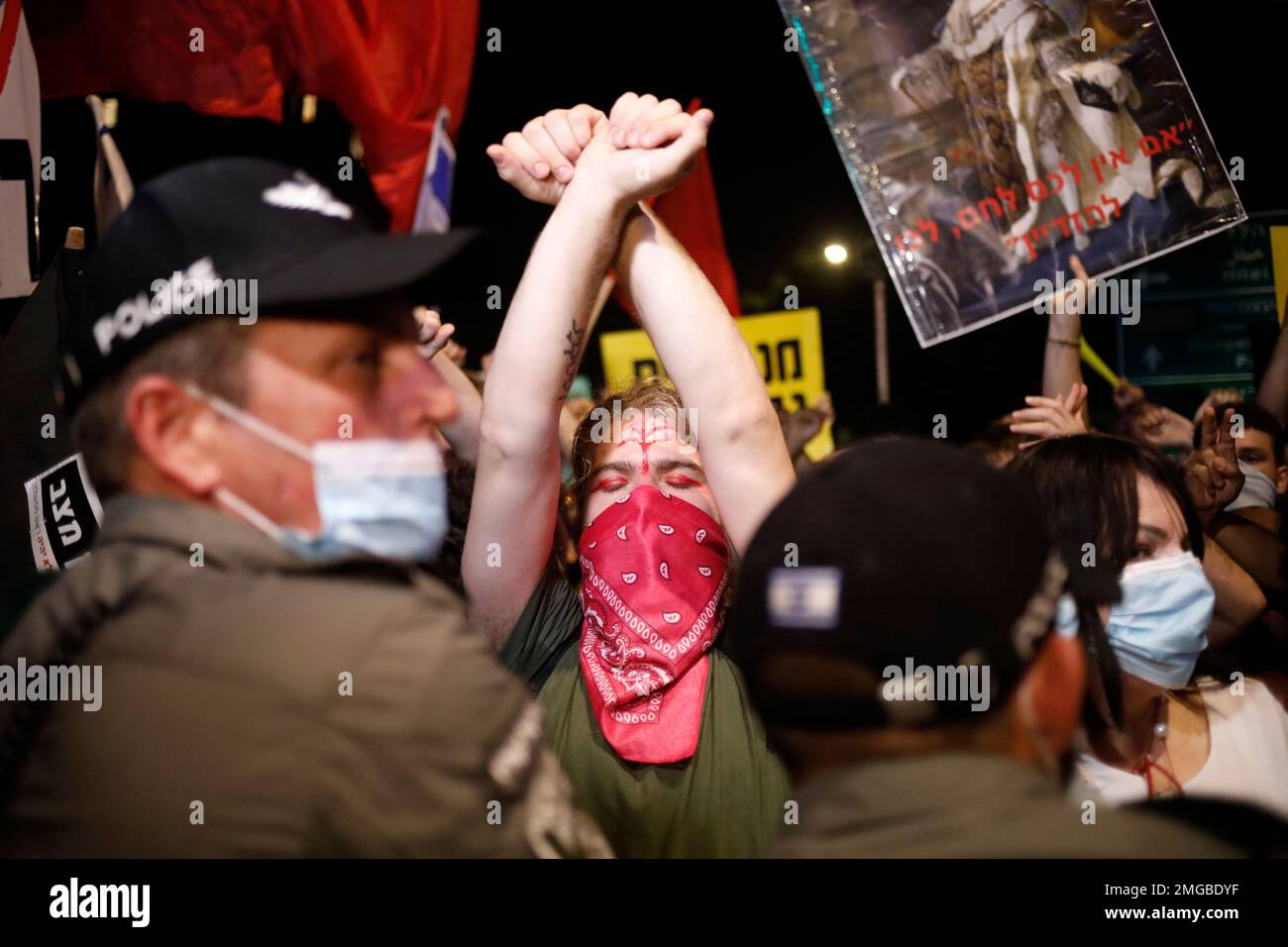 Demonstrators, defying orders to maintain social distancing ...