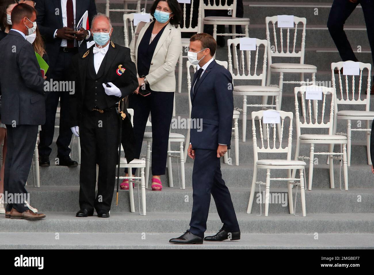 France's President Emmanuel Macron wears a face mask at the end of the ...
