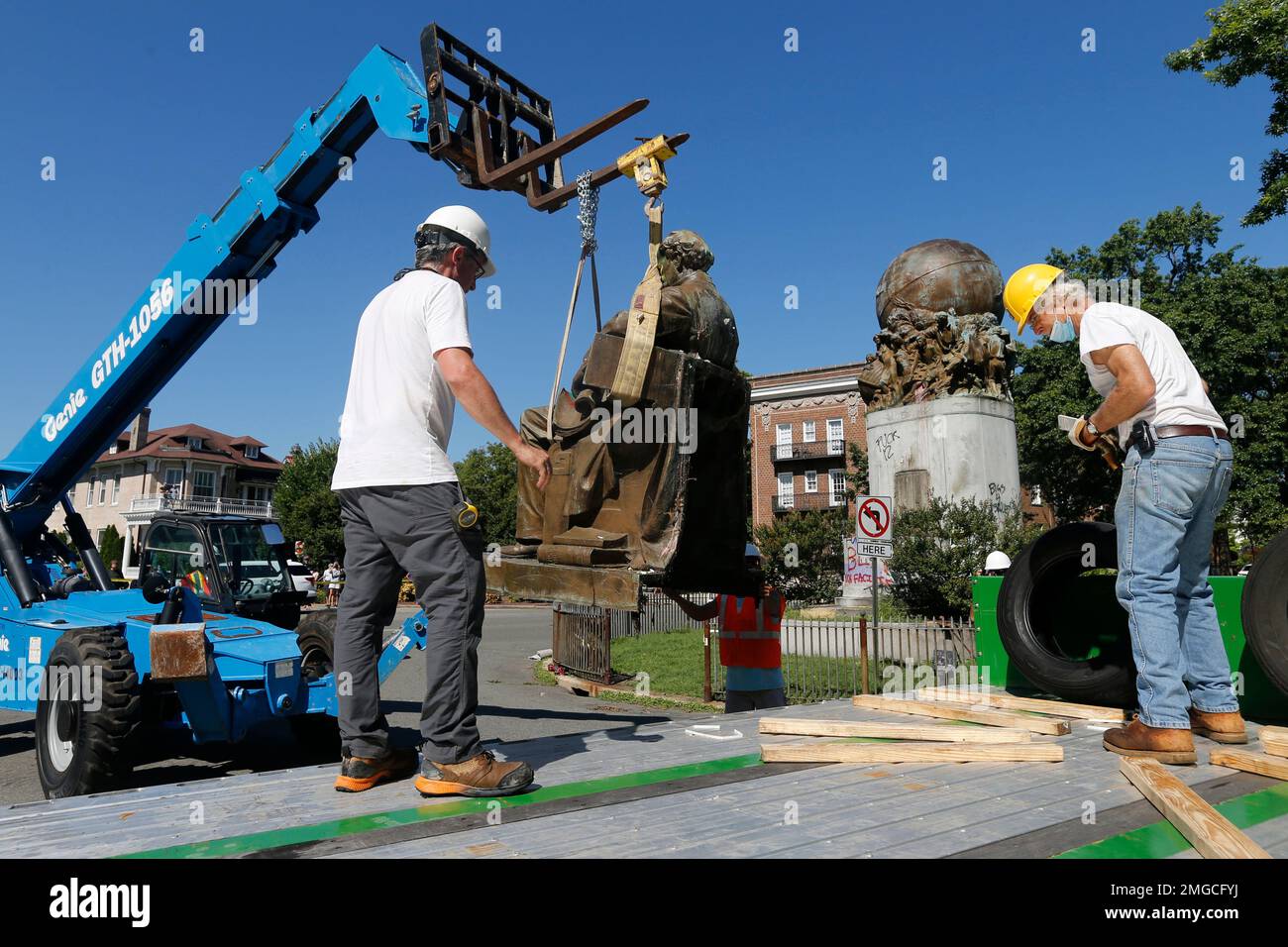 EDS NOTE: OBSCENITY - Workers remove the statue of Confederate Naval ...
