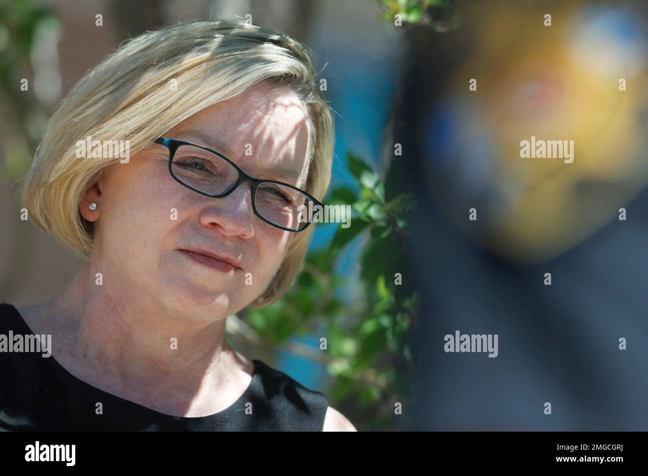 Kimberly Obremski La Tourette of Lee, N.H., listens as Holly Nicholson ...
