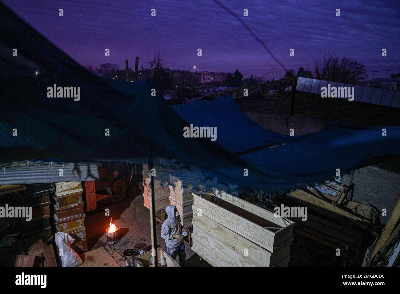 Coffin makers work at the Bergut Funeral Services factory in Santiago ...