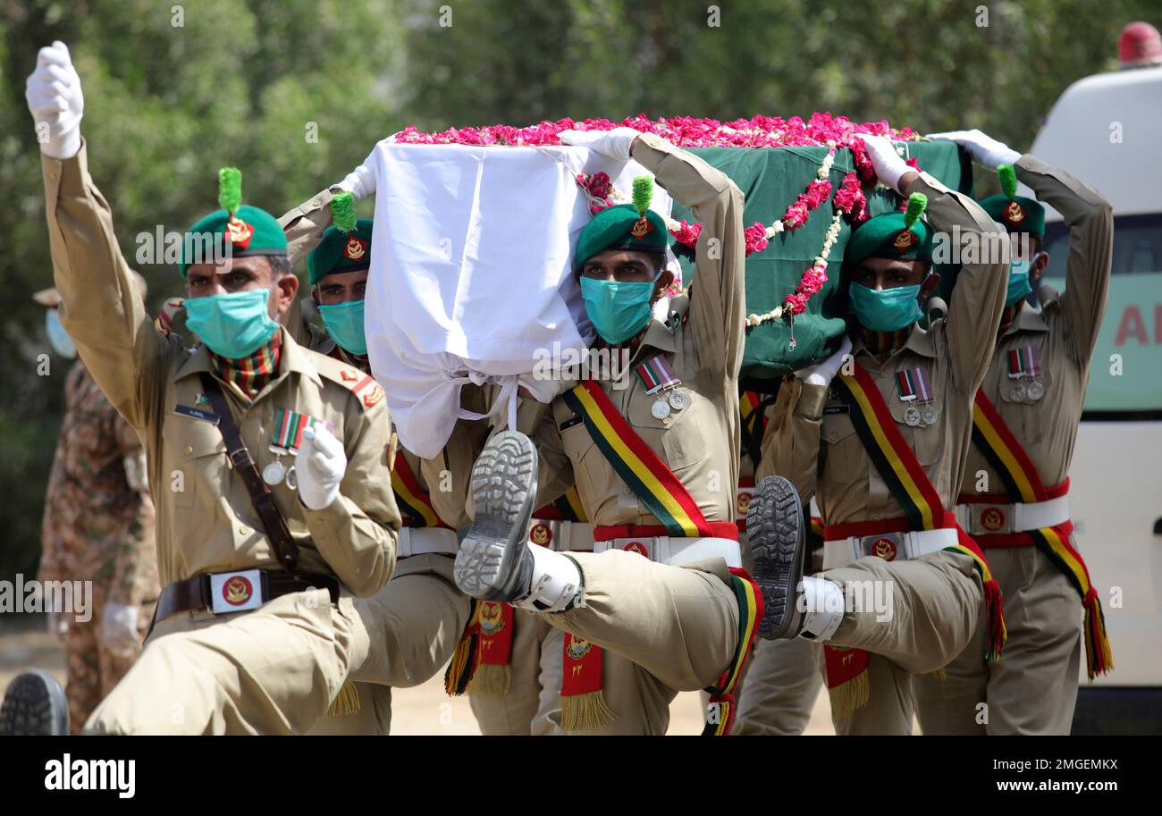 Pakistani soldiers carry the coffin of their colleague who died in the ...