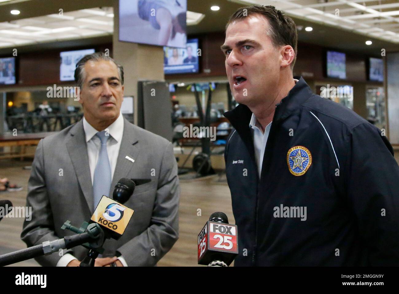 Bahram Akradi, left Life Time CEO and Oklahoma Gov. Kevin Stitt, right ...
