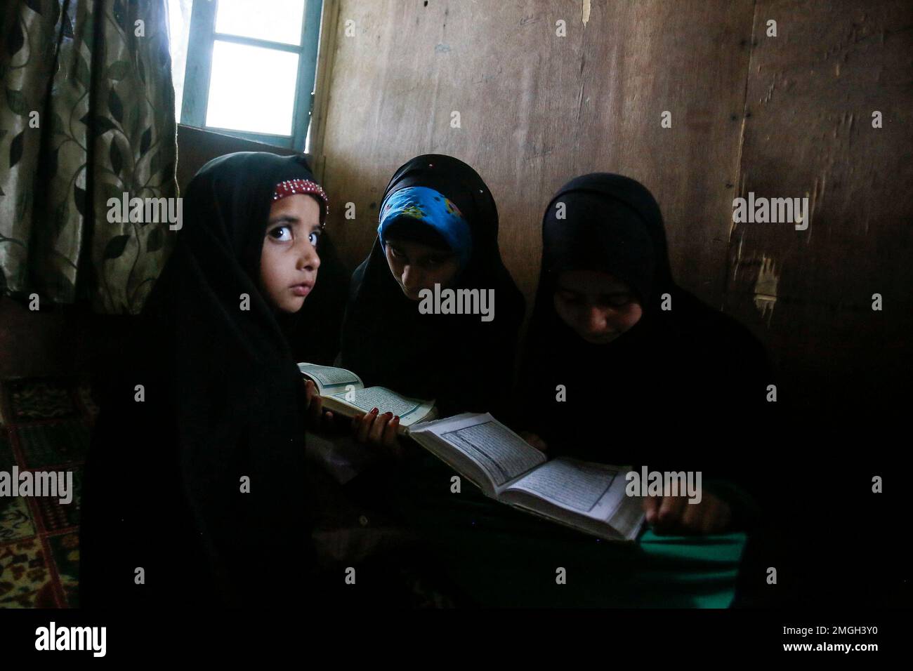 Kashmiri Muslim children attend recitation classes of the holy Quran on the first day of the ...