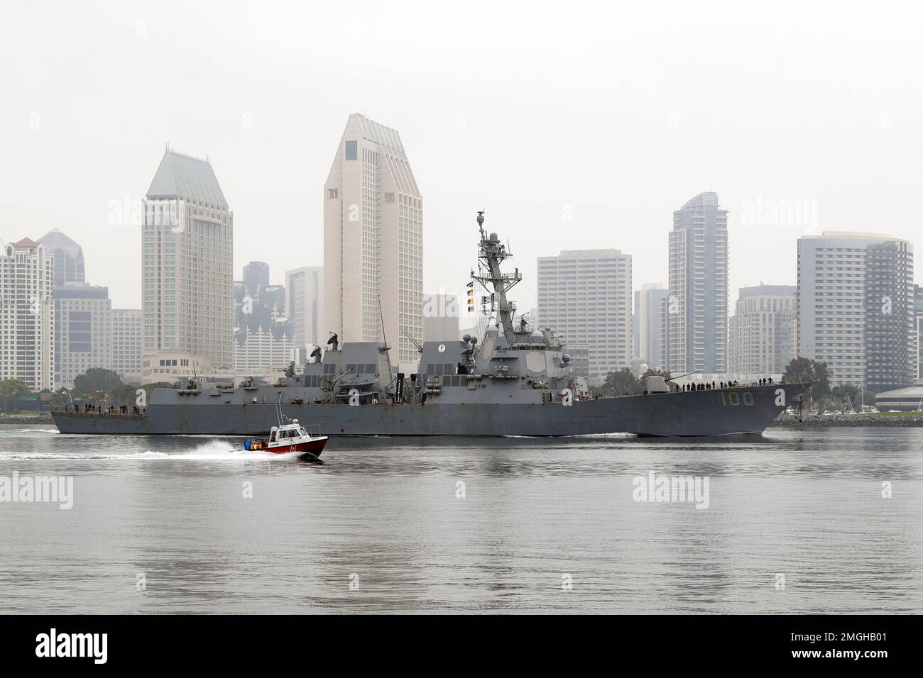In this April 28, 2020, photo, the USS Kidd passes downtown San Diego ...