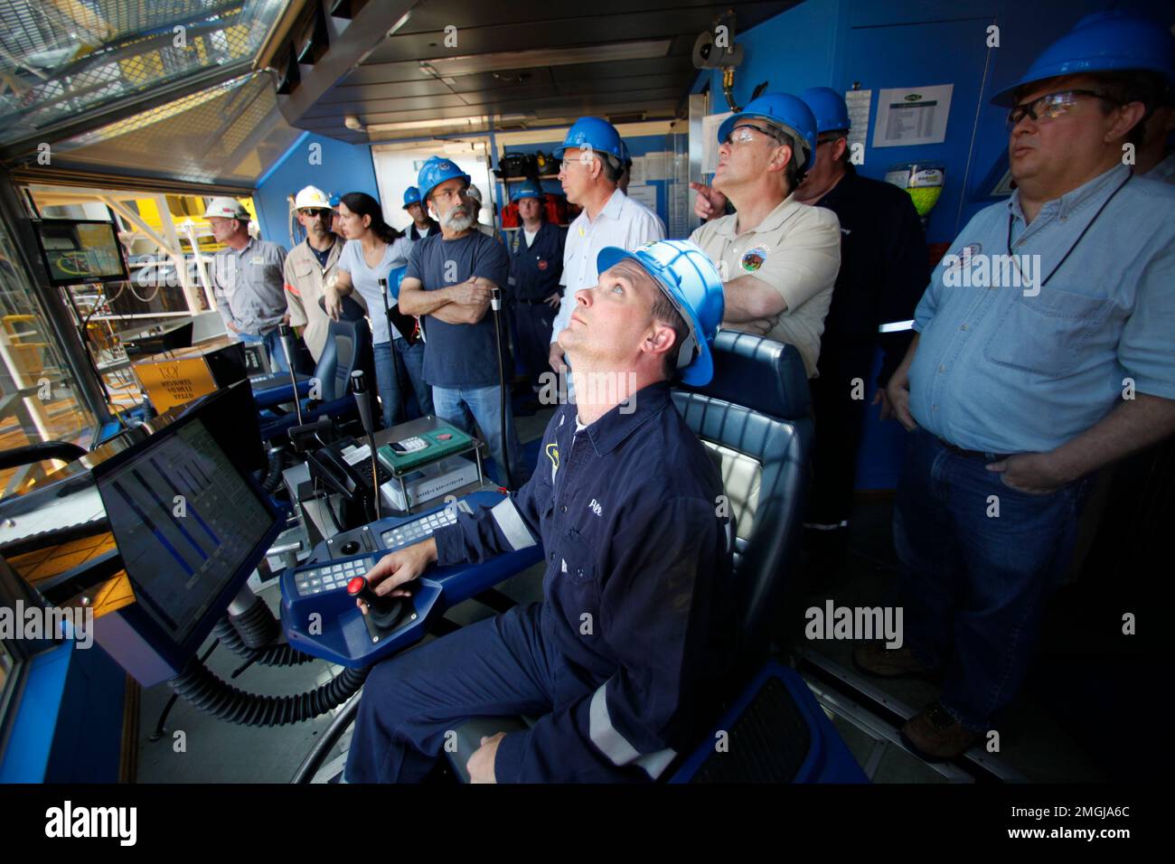 FILE - In this July 28, 2010 file photo, driller Allen Griffin looks up ...