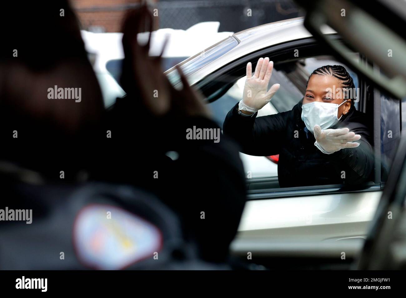 Chicago Police officer Cheryl Clark, right, greets co-workers while she is waiting to get vital ...