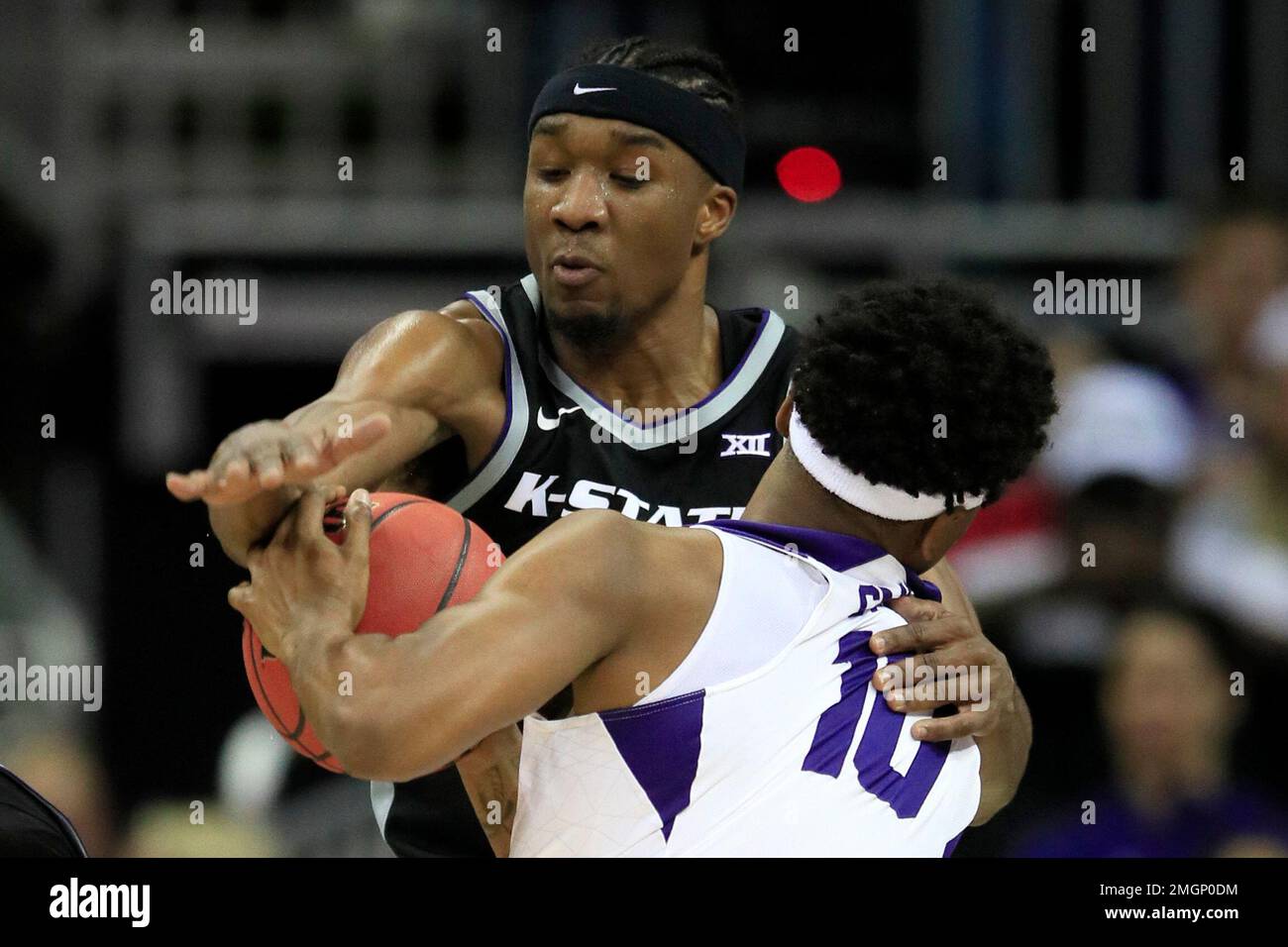 TCU forward Diante Smith (10) is called for traveling when he ran into ...