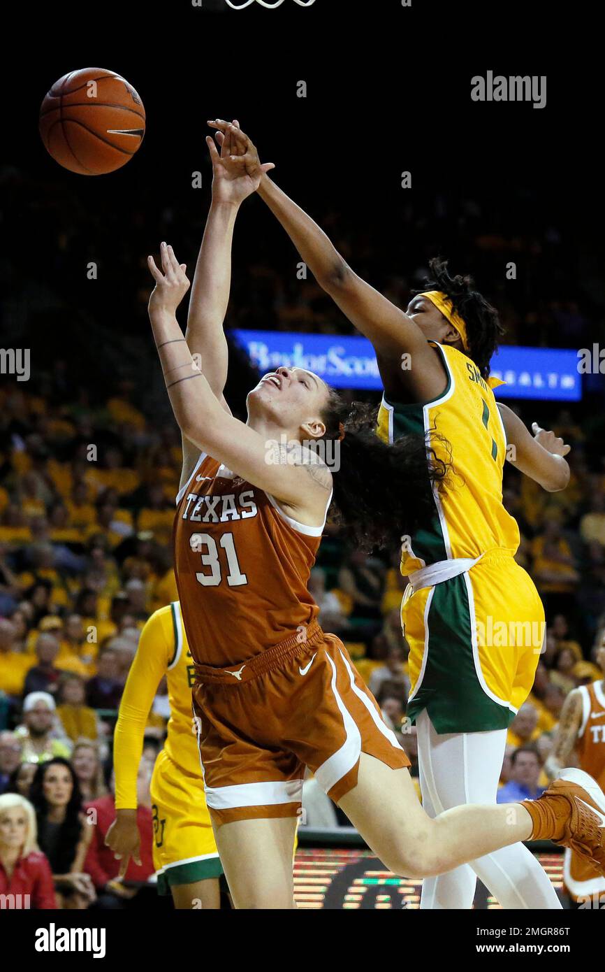 Baylor forward NaLyssa Smith, right, blocks the shot of Texas guard ...