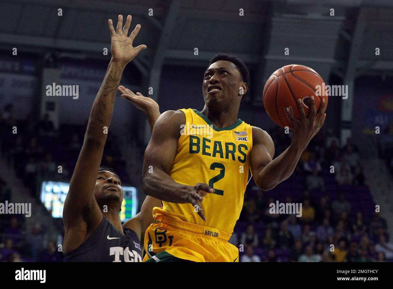 Baylor guard Devonte Bandoo (2) goes up for a shot against TCU forward ...