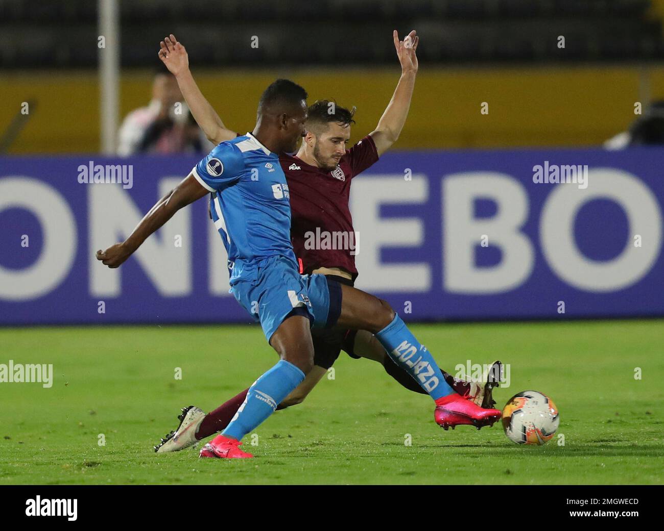 Nicolas Morgantini of Argentina's Lanus, right, fights for the ball ...