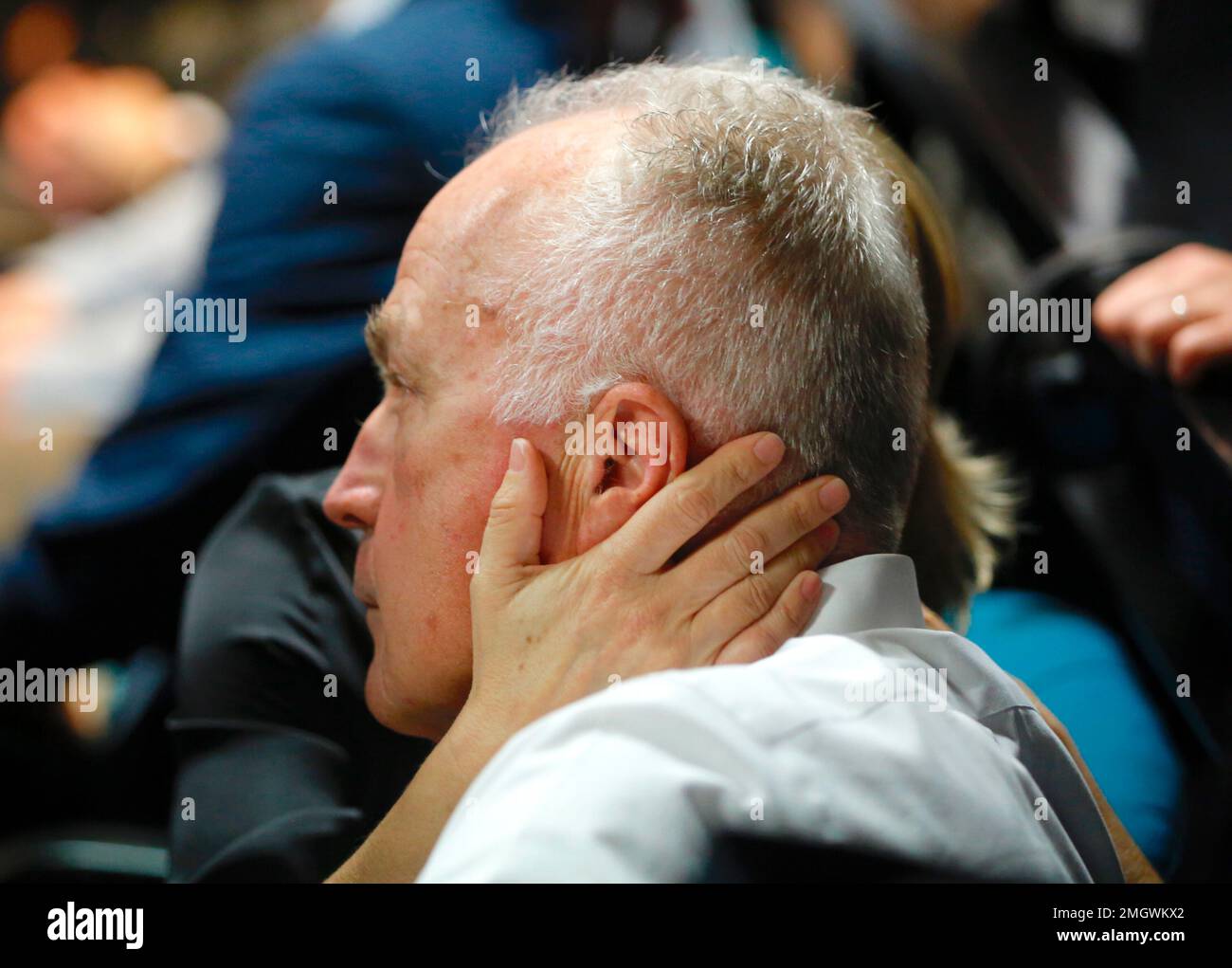 Ethan Elder, father of Finnegan Lee Elder, is hugged by his wife Leah ...