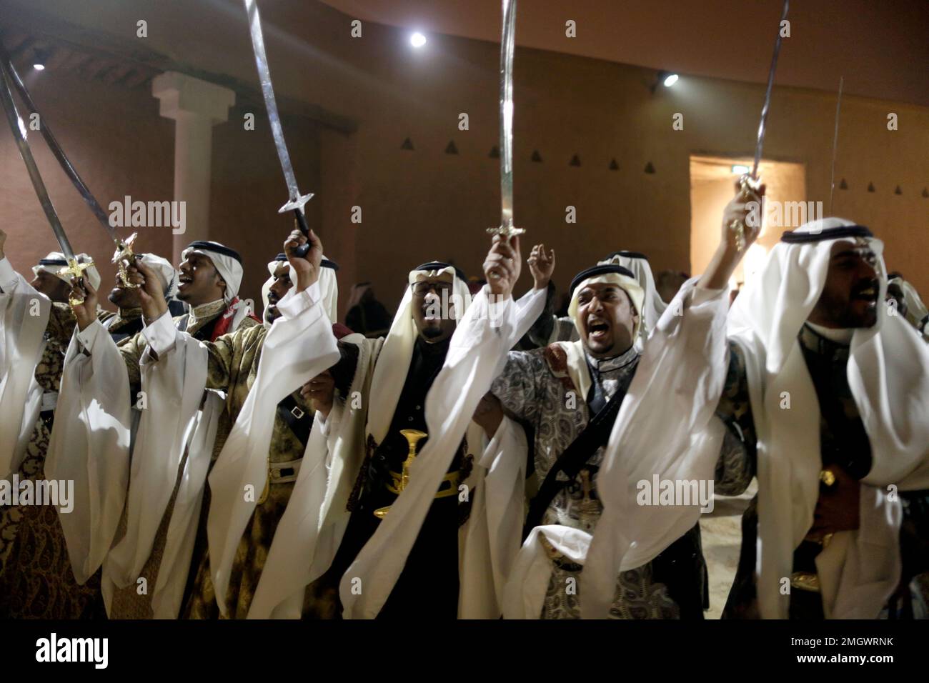 Saudi dancers perform with swords during the traditional dancing best ...