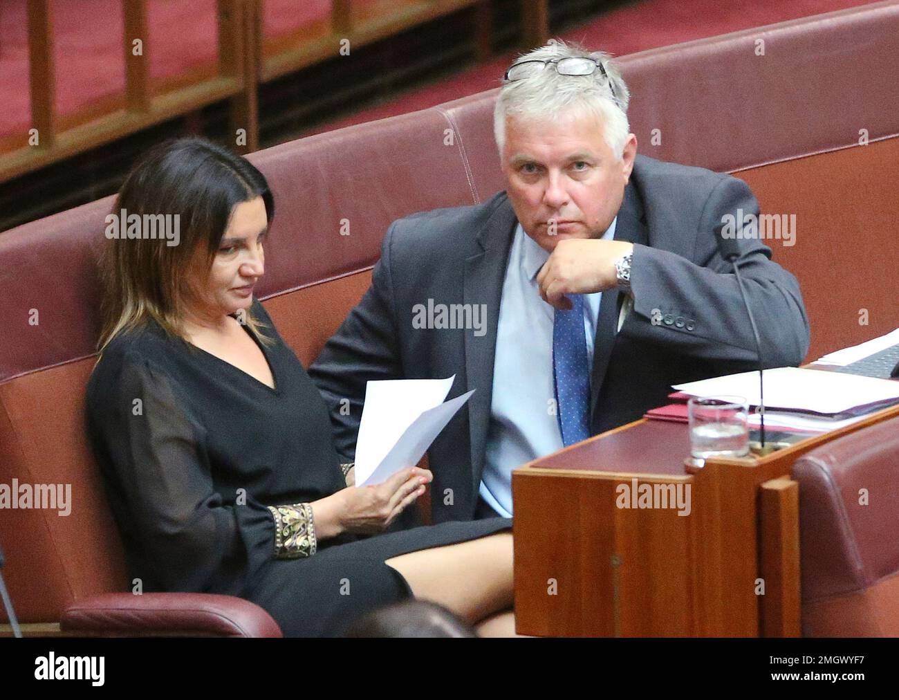 Senators Jacqui Lambie, left, and Rex Patrick talk in the Senate in ...