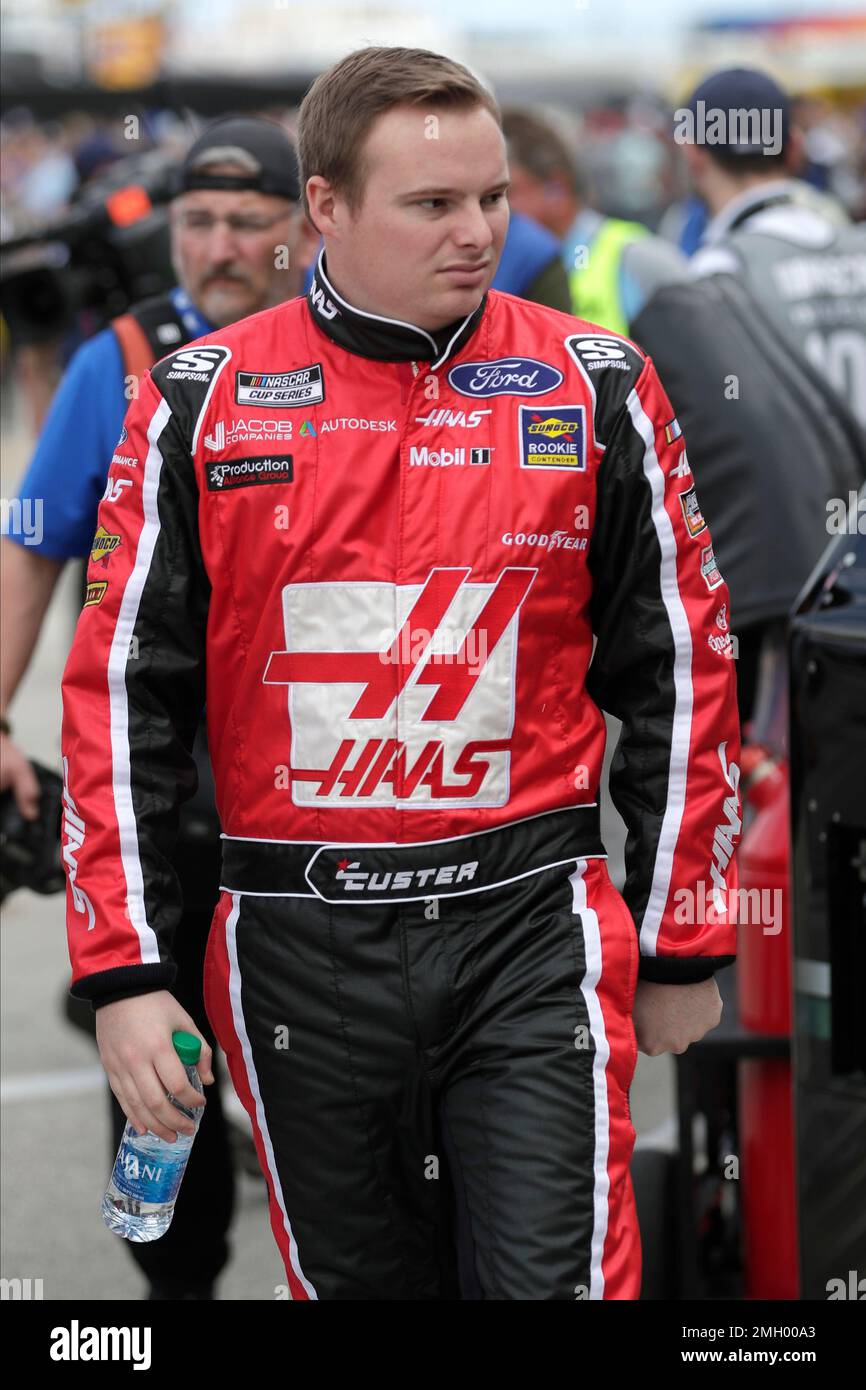 Cole Custer walks in the garage area during a practice session for the ...