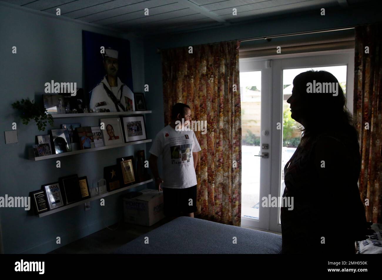 Corey Hixon, 24, left, and Debbi Hixon, right, stand in a renovated ...
