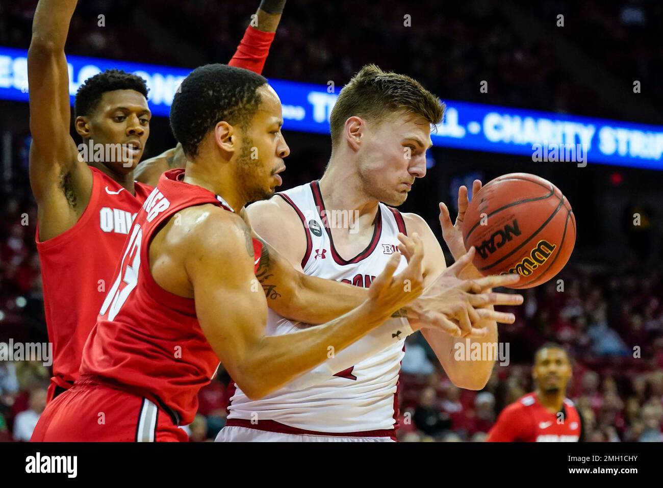 Ohio State's CJ Walker (13) fouls Wisconsin's Tyler Wahl, right, during ...