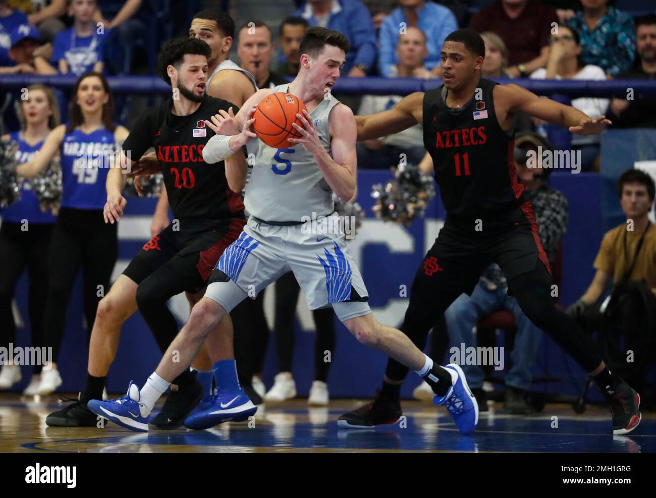 Air Force guard Chris Joyce, front, looks to drive to the basket as San ...